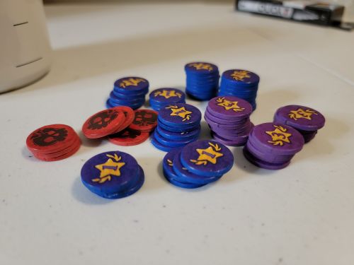 Edge painting board game tokens