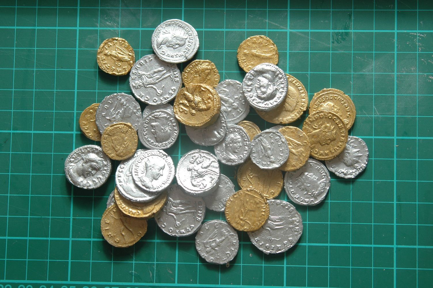 Making plastic replica tokens of Roman coins.